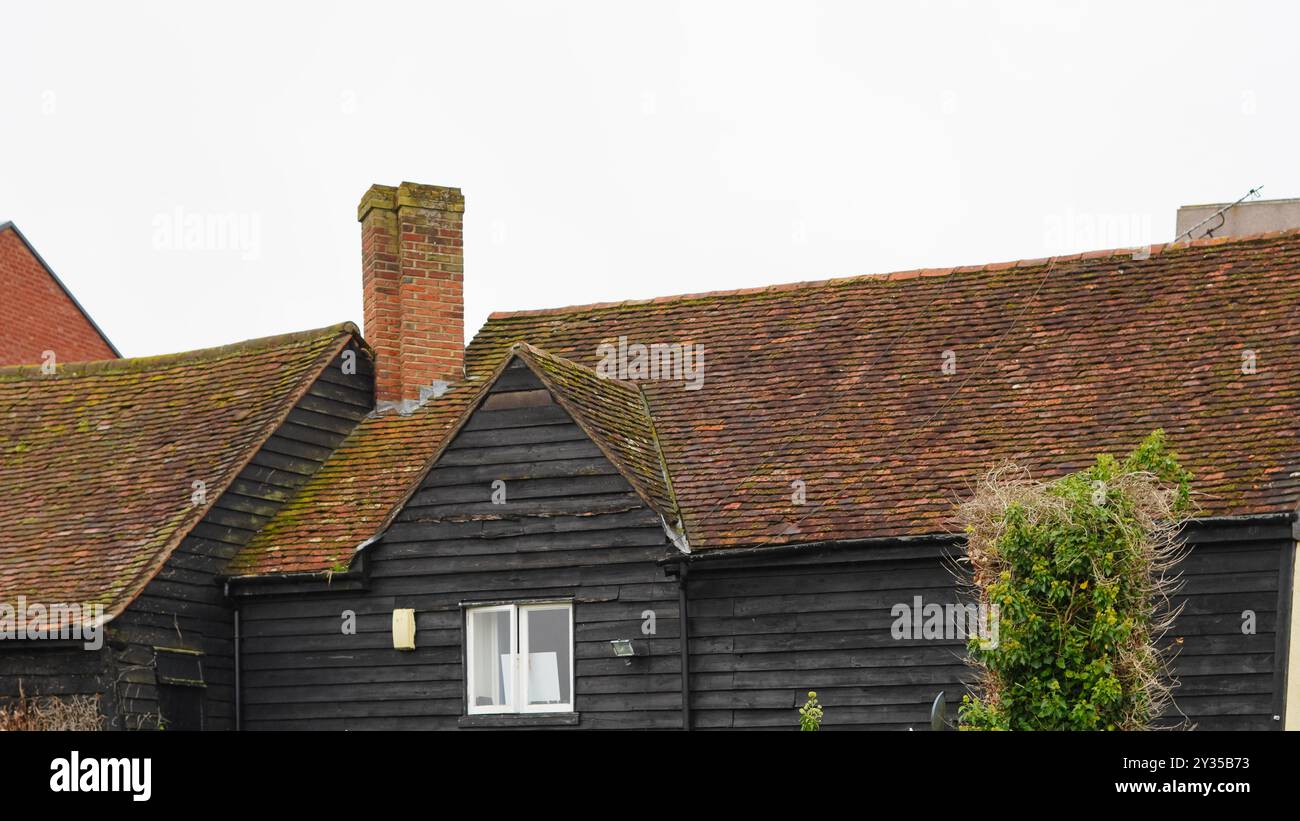 Traditional English house brick roofs, suburban area Stock Photo - Alamy