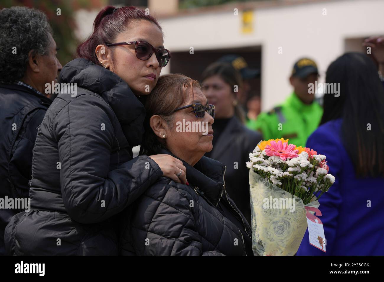 Supporters of former President Alberto Fujimori gather outside the home ...