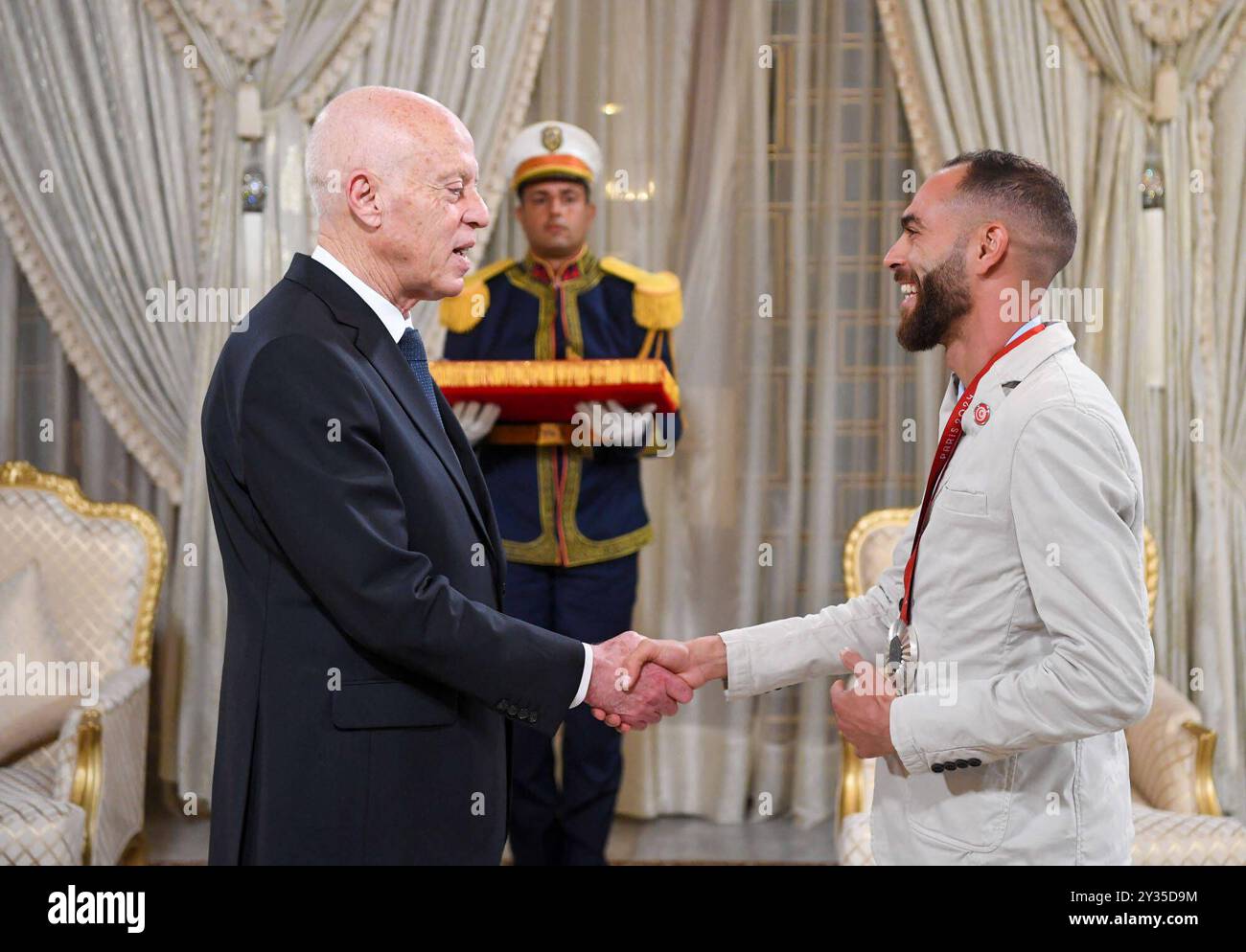 Tunisian President Kais Saied honors champion Rawaa Tlili, who won a ...