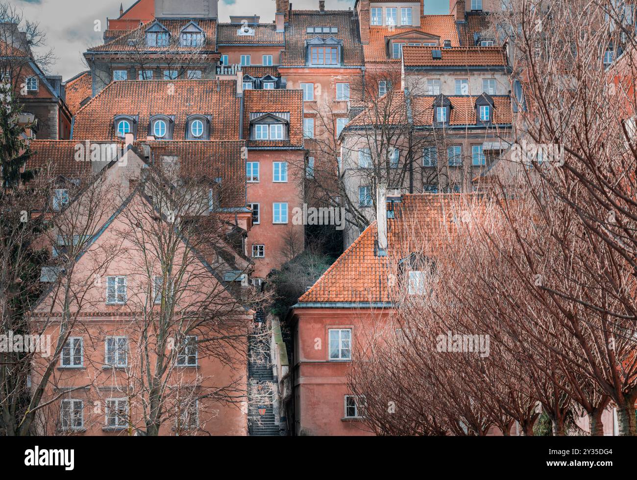 Historic tenement houses. Old housing estate. Roofs and windows facades ...