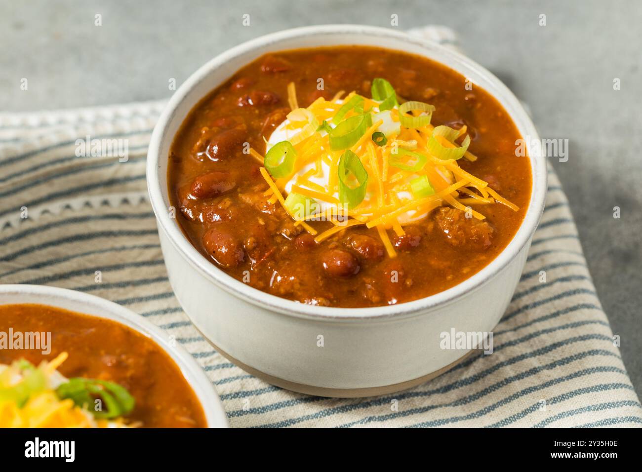 Mexican Homemade Beef Chili Con Carne with Cheese and Onions Stock ...