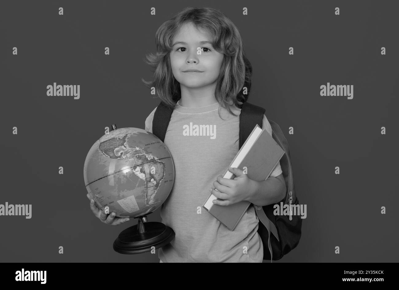 Pupil, nerd schoolboy. School boy with world globe and book. Kid boy ...