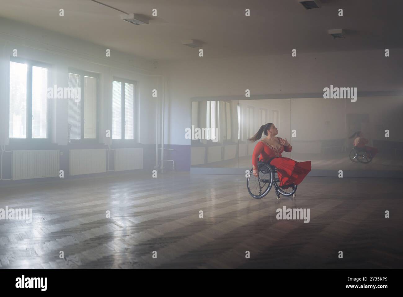 Beautiful dance in a wheelchair of a woman with disability at a dancing ...