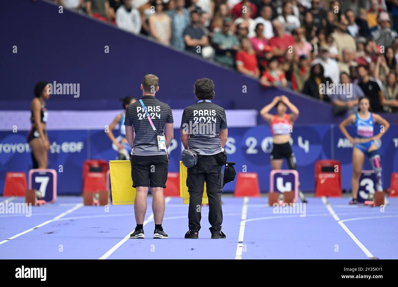 Track officials getting the athletes ready to compete in the women’s ...