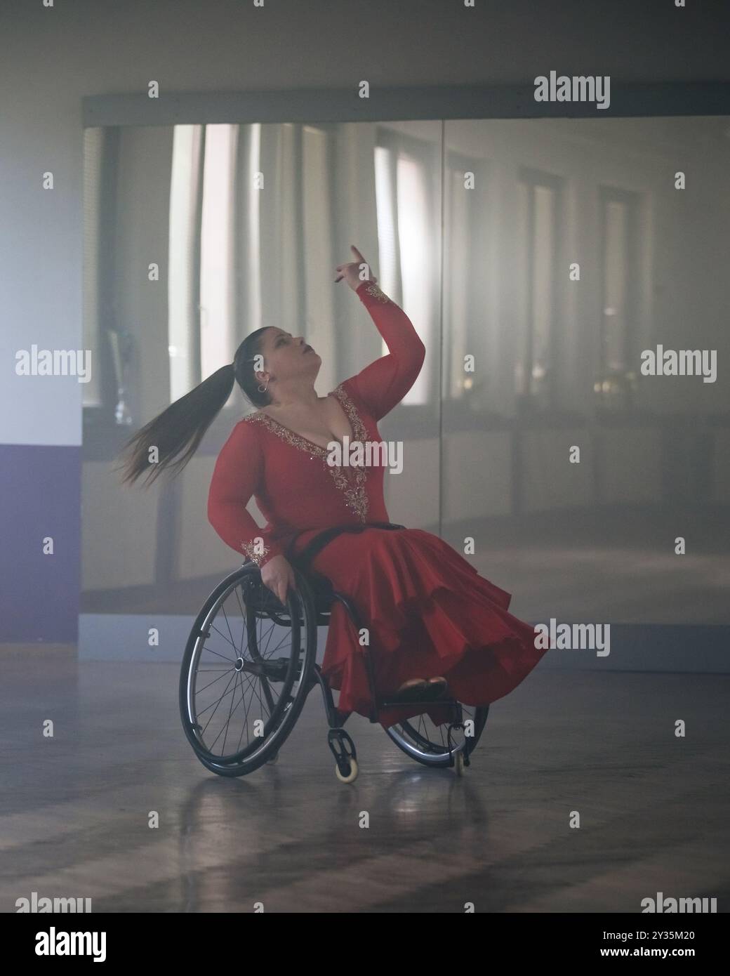 Beautiful dance in a wheelchair of a woman with disability at a dancing ...