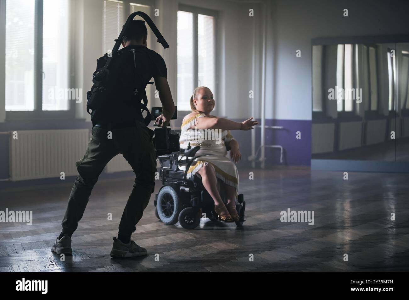 Female para dancer performing dance choreography on wheelchair with ...