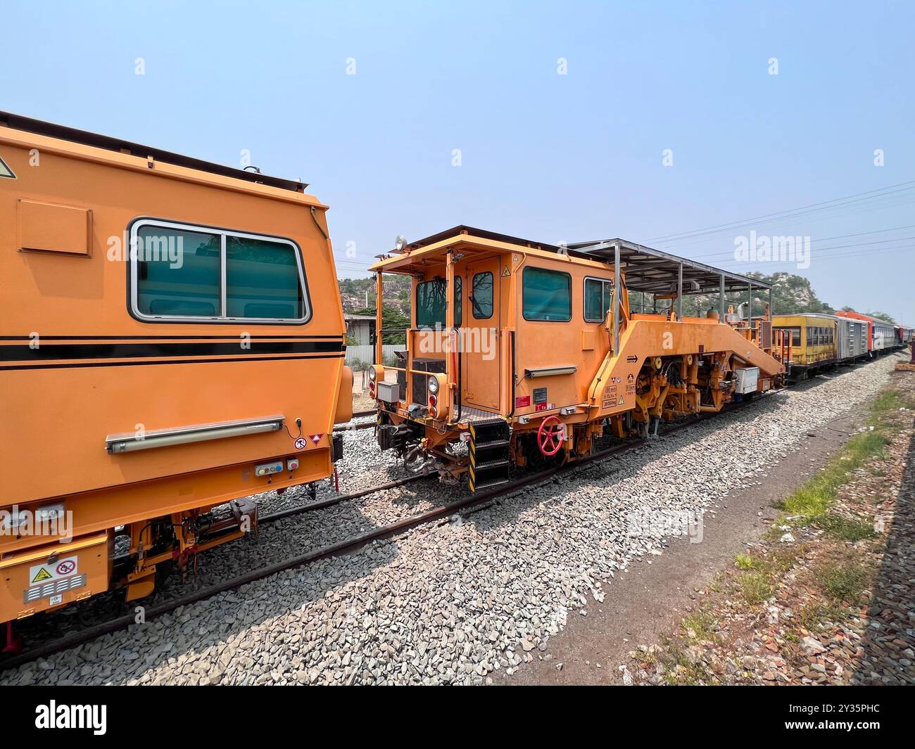 The ballast tamping machines are parked in the site to maintain the ...