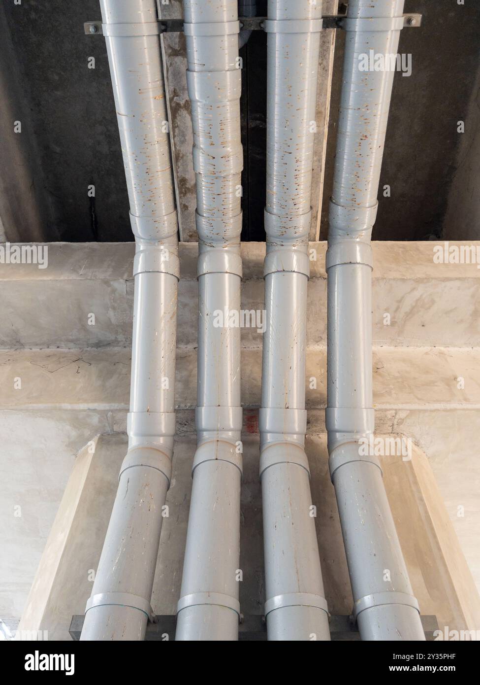 The PVC pipe row near the concrete wall for the drainage system in the ...