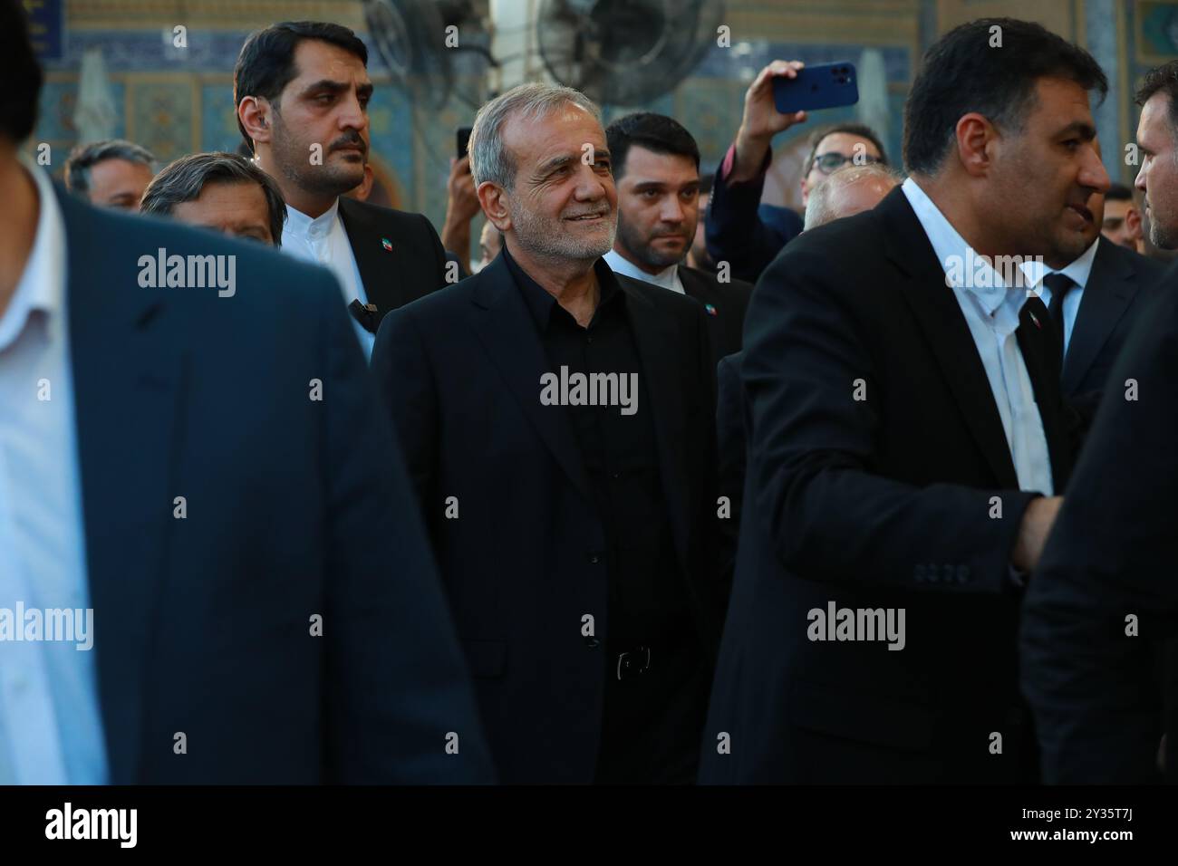 Najaf, Iraq. 12th Sep, 2024. Iranian President Masoud Pezeshkian (C ...