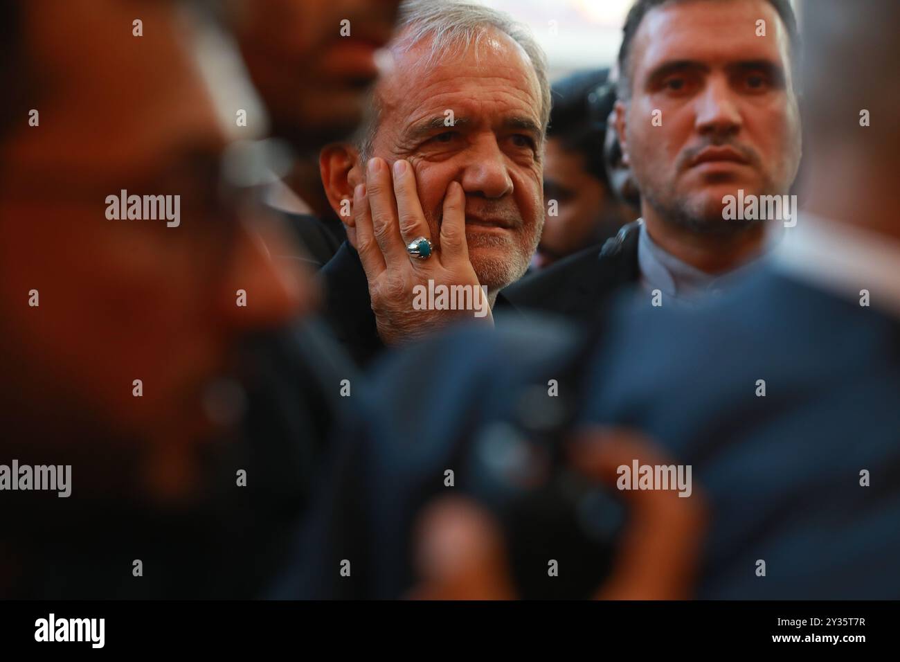 Najaf, Iraq. 12th Sep, 2024. Iranian President Masoud Pezeshkian (C ...