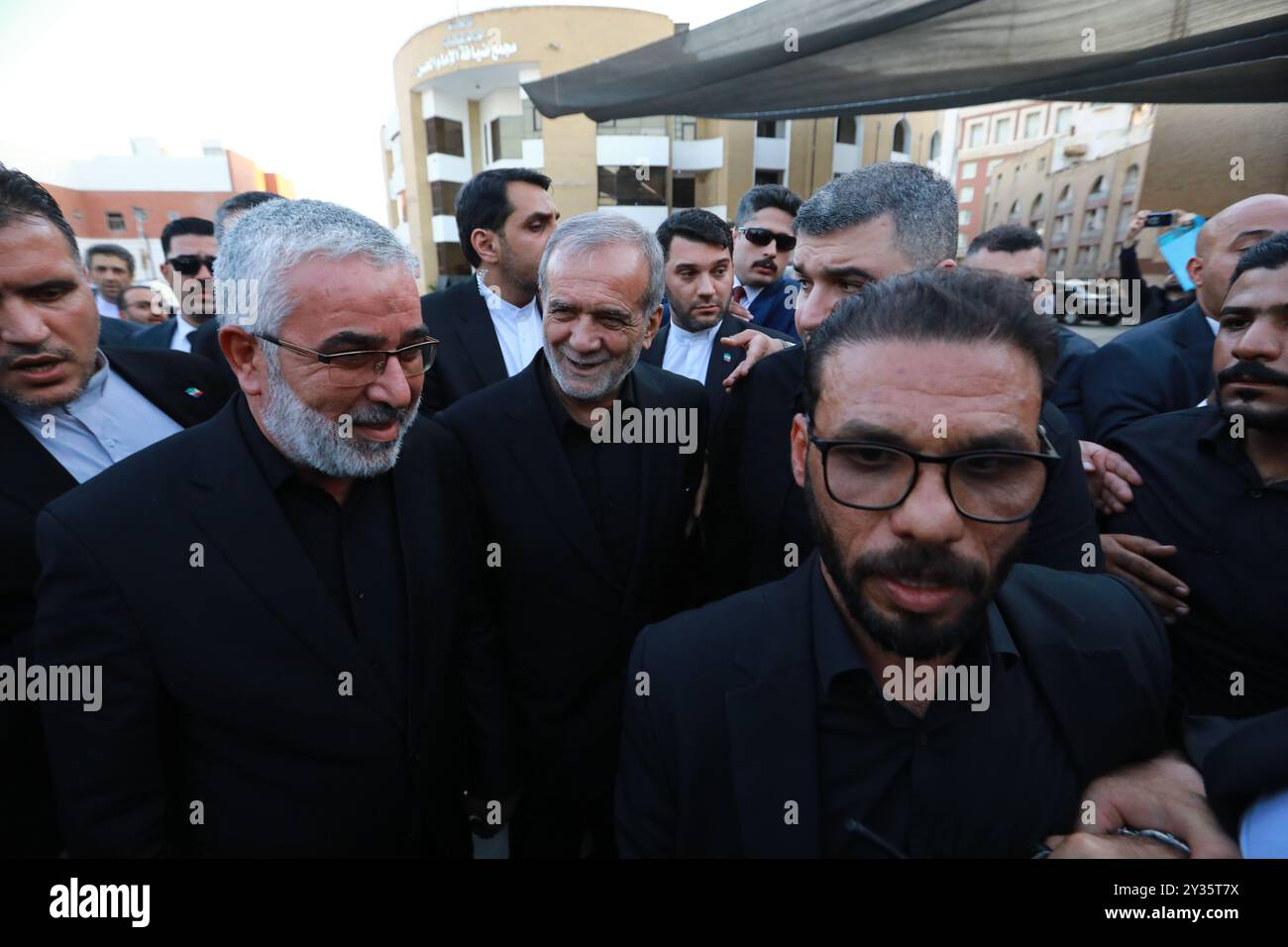 Najaf, Iraq. 12th Sep, 2024. Iranian President Masoud Pezeshkian (C ...