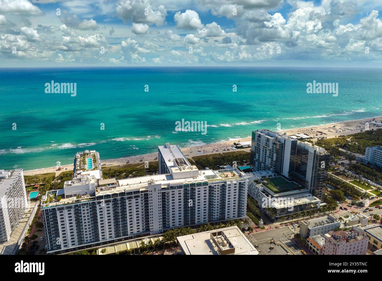 Aerial view of South Beach sandy surface with tourists relaxing on hot ...