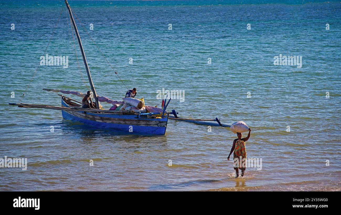 Madagascar — April 27, 2023. A woman dressed in a traditional lamba ...