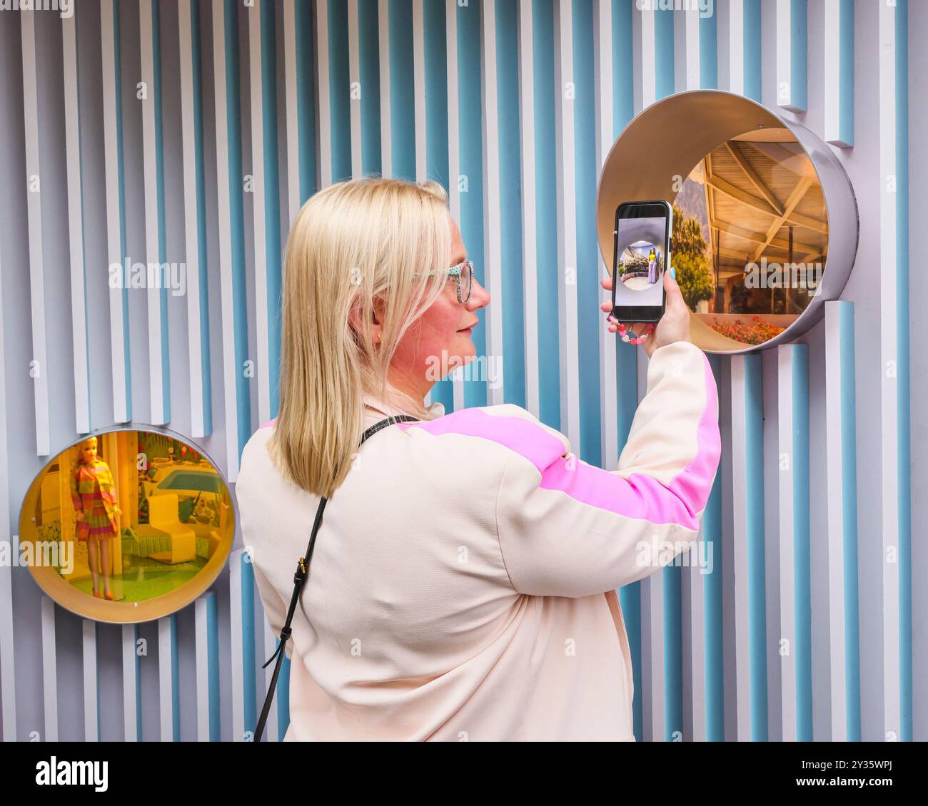 London, UK. 12th Sep 2024. Festival associates take pictures and look ...