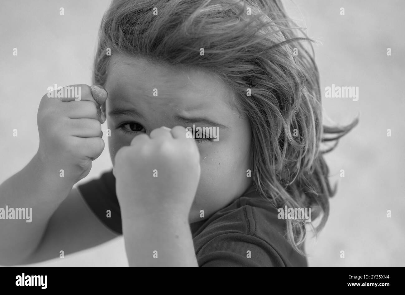 Enraged kid boy with angry expression. Angry hateful little anger boy ...