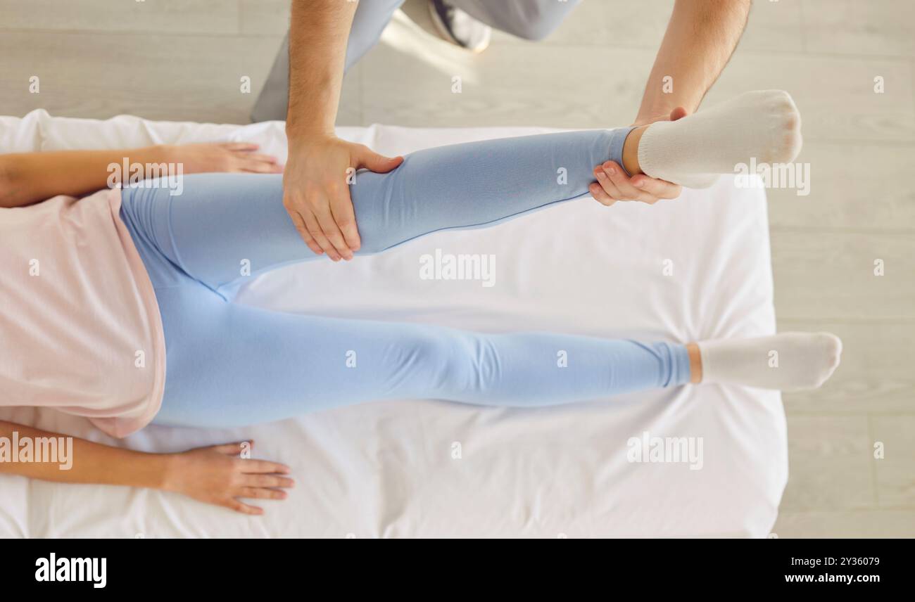 Leg, knee rehabilitation and therapy by professional trainer nurse ...