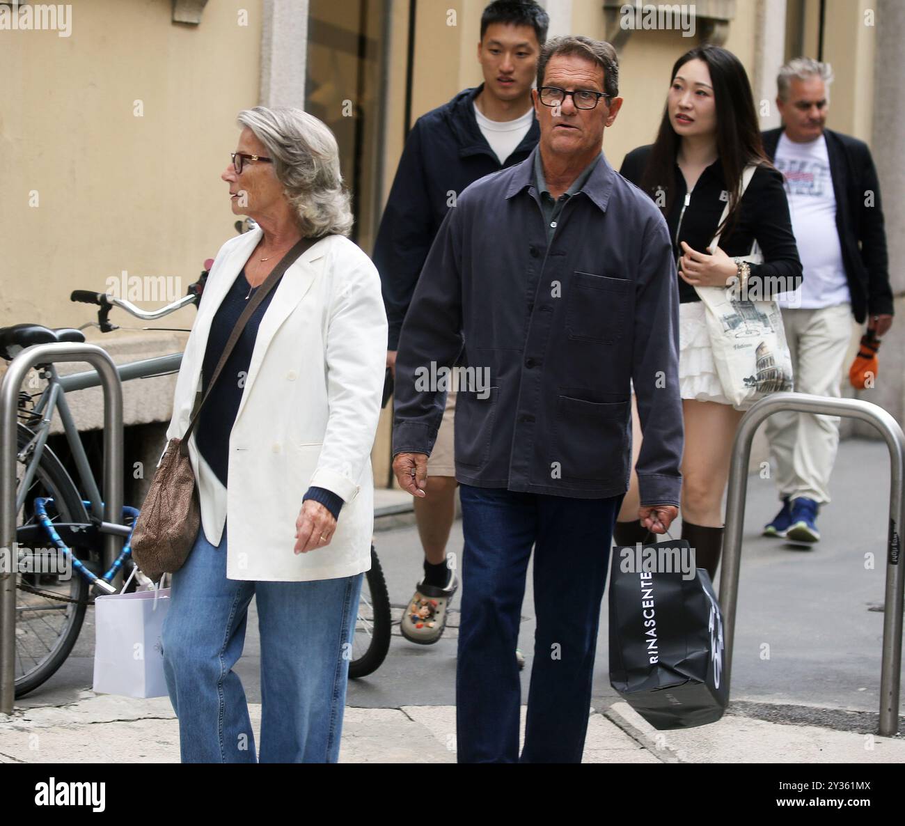 Fabio Capello walks with his wife Laura in via Montenapoleone Stock ...
