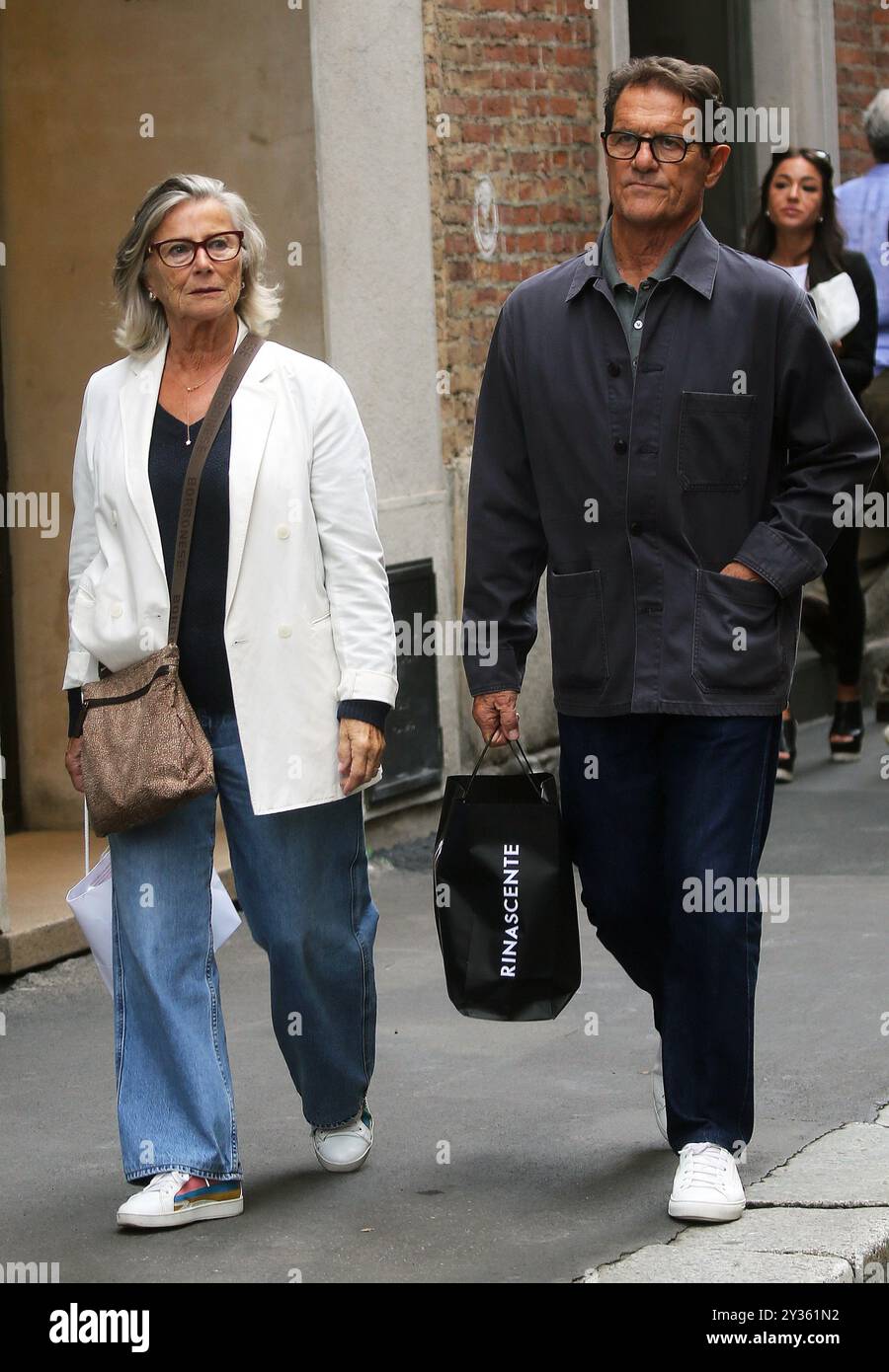 Fabio Capello walks with his wife Laura in via Montenapoleone Stock ...