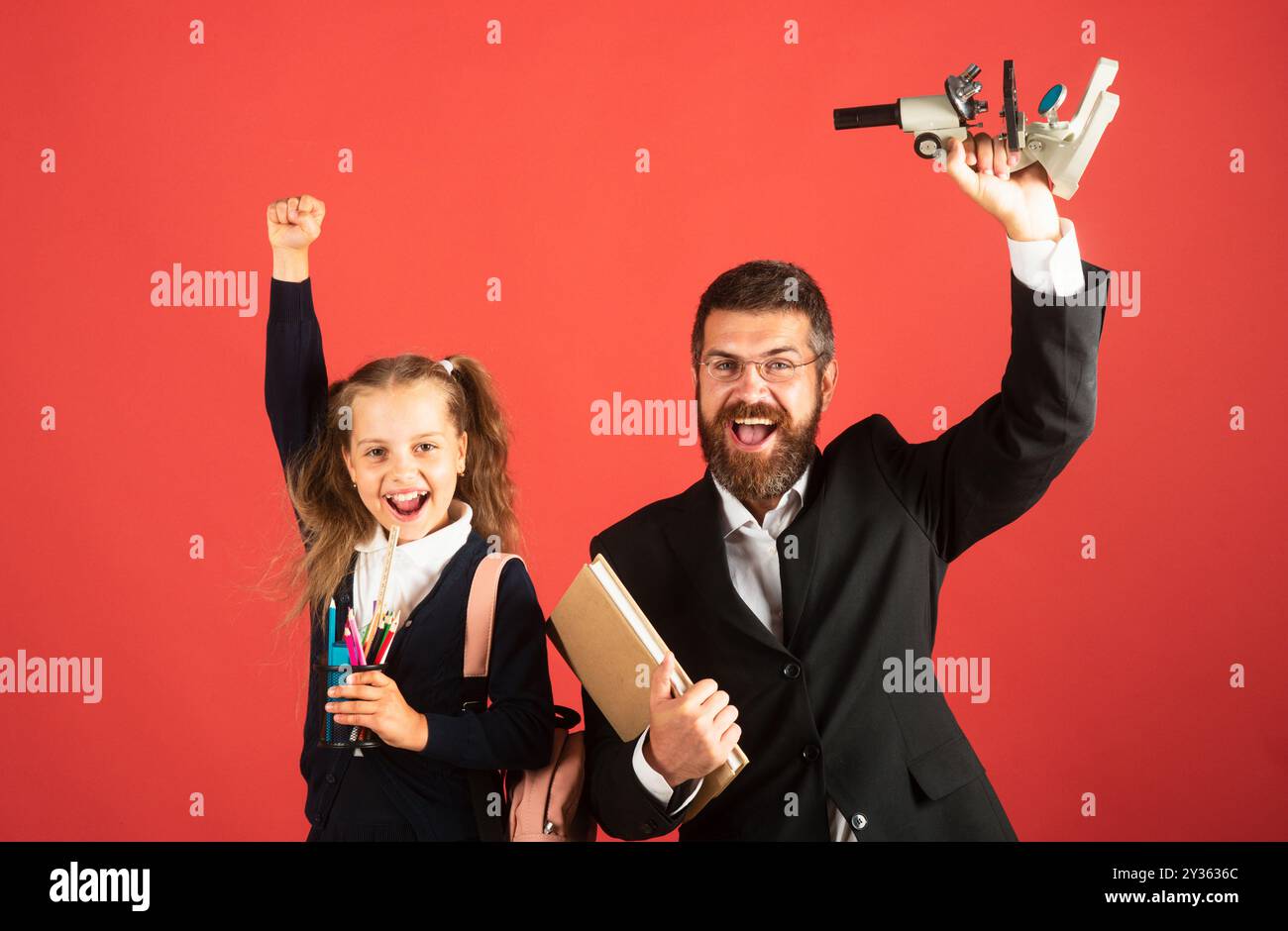 Tutor with school girl with successful exercise finish Stock Photo - Alamy