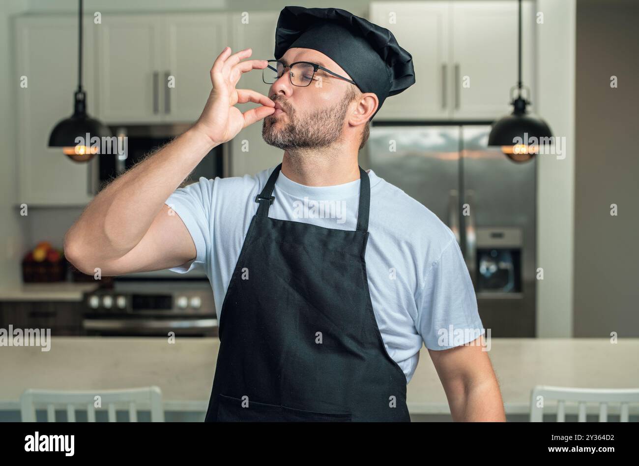 Portrait of chef cooker in kitchen. Chef with sign of perfect food ...
