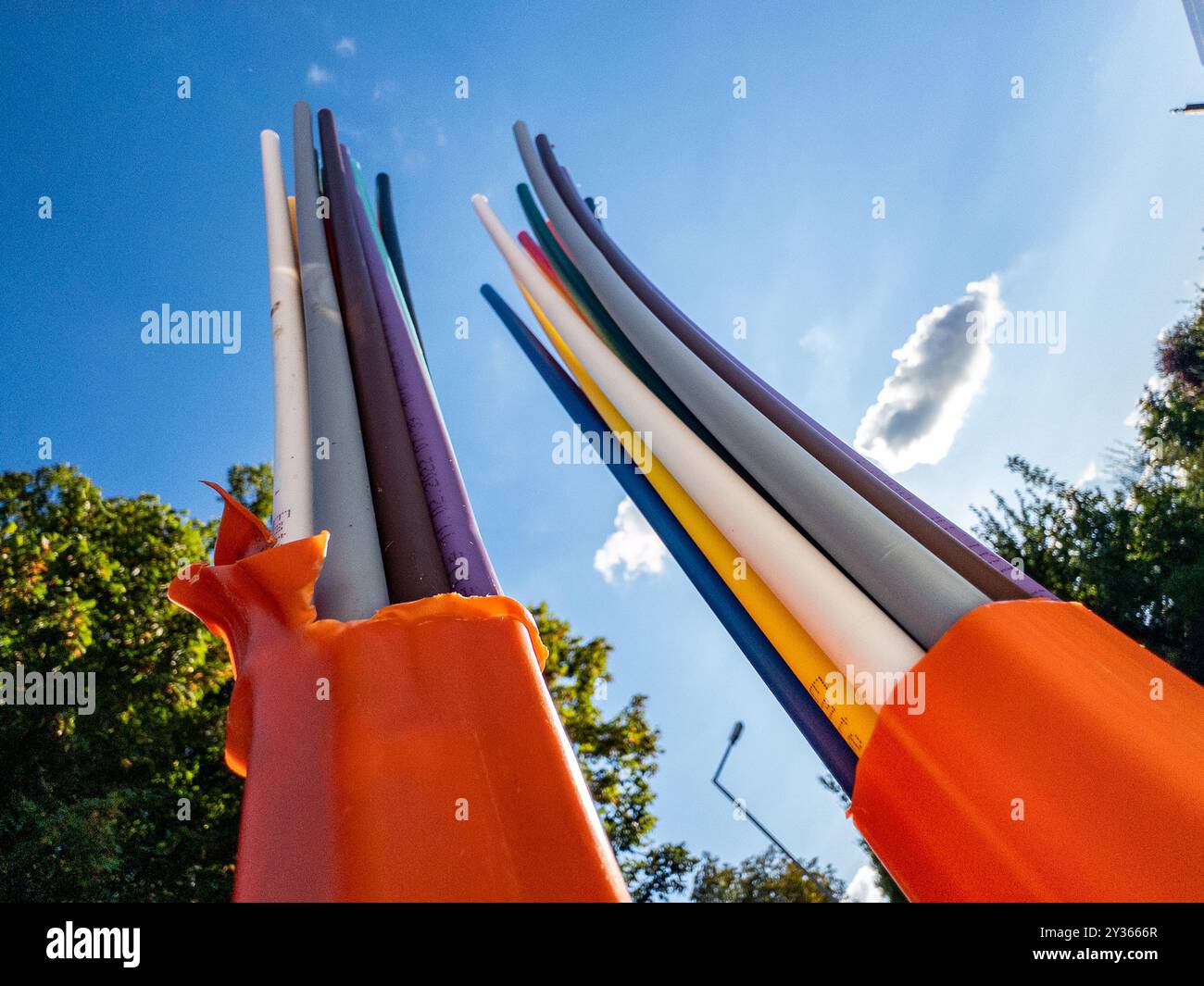 Conduits and fibre optic cables in public waiting to be connected to ...