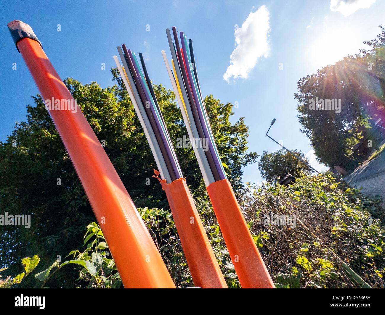 Conduits and fibre optic cables in public waiting to be connected to ...