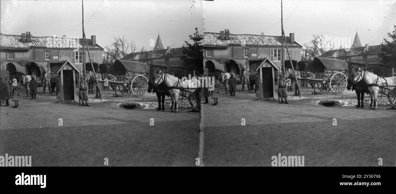 World War 1 a French soldier mans a guard post near horse-drawn wagons ...