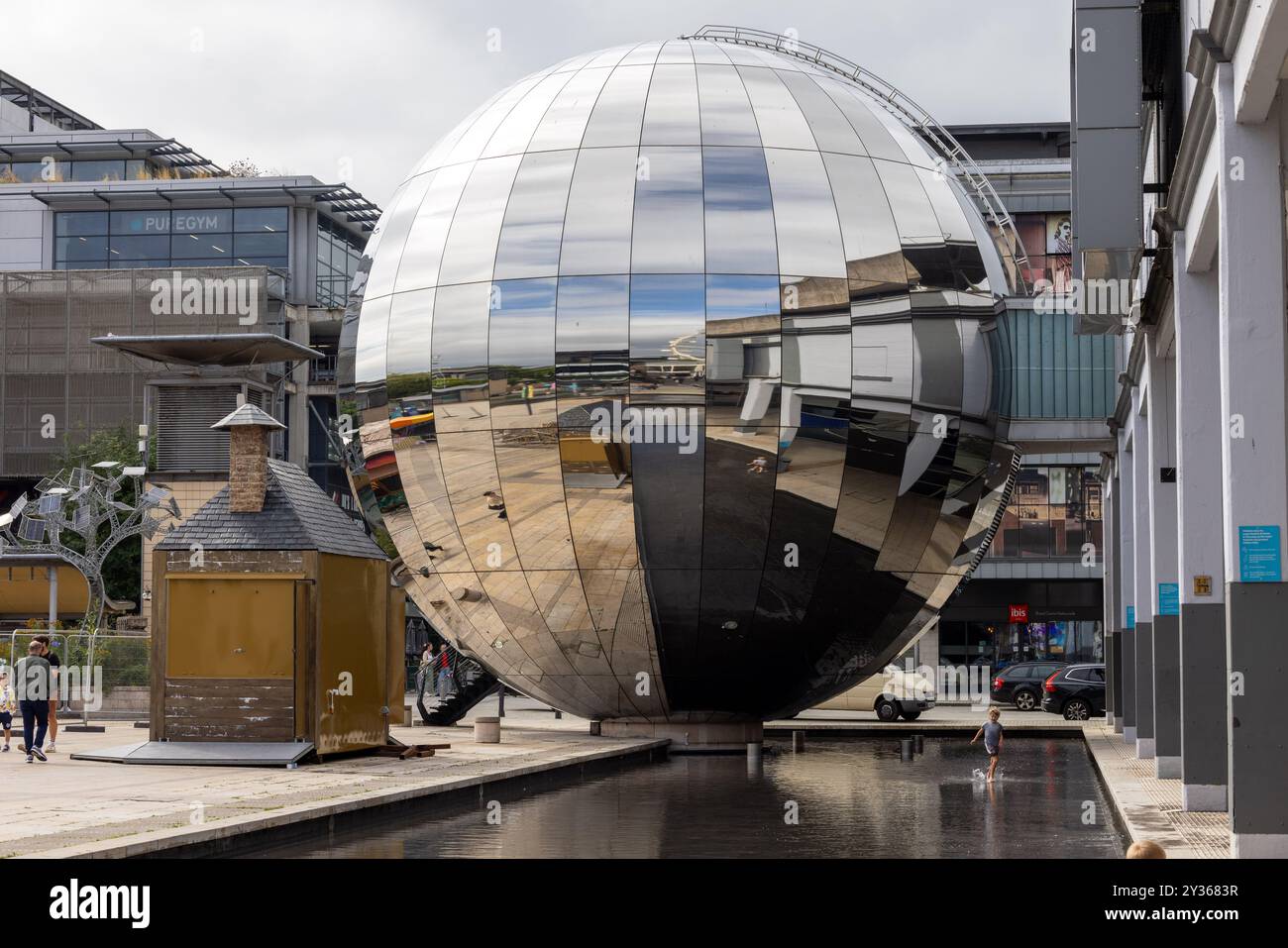 The globe of the planetarium at We The Curious in Millennium Square, Bristol Stock Photo - Alamy