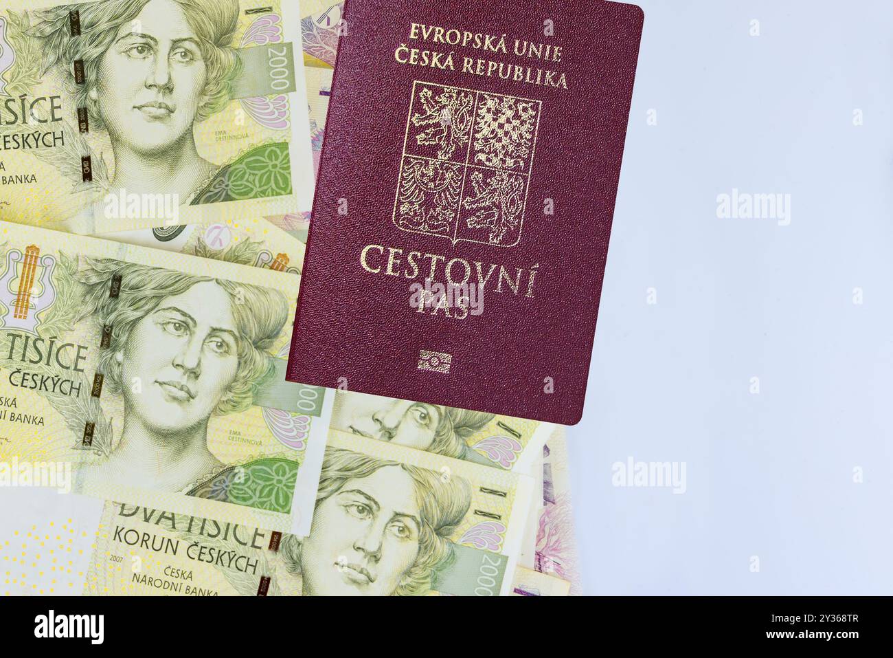 Czech Republic passport with various denominations CZK koruna banknotes ...