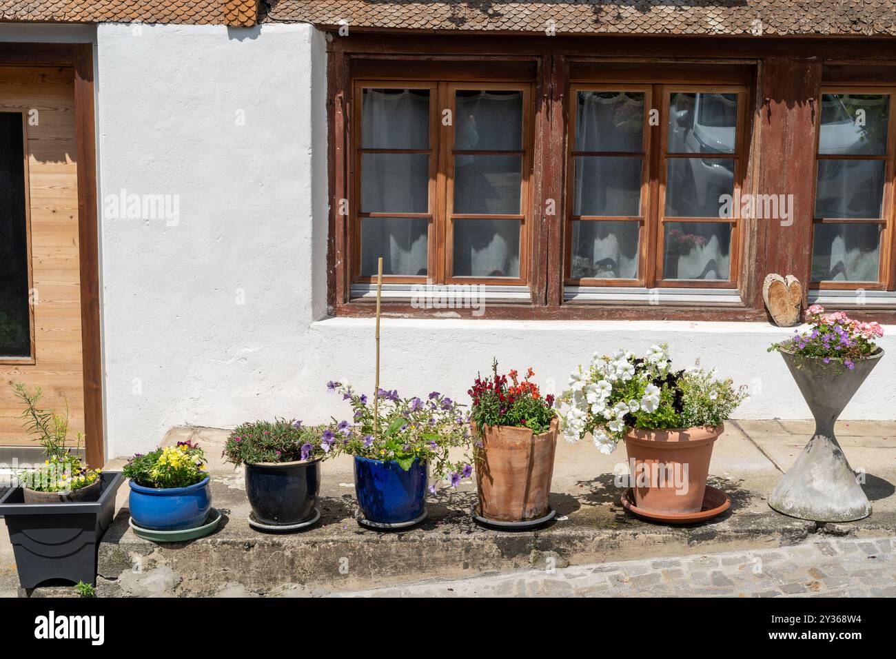 Potted plants on Brunngasse Street, Brienz, Switzerland. This Street ...