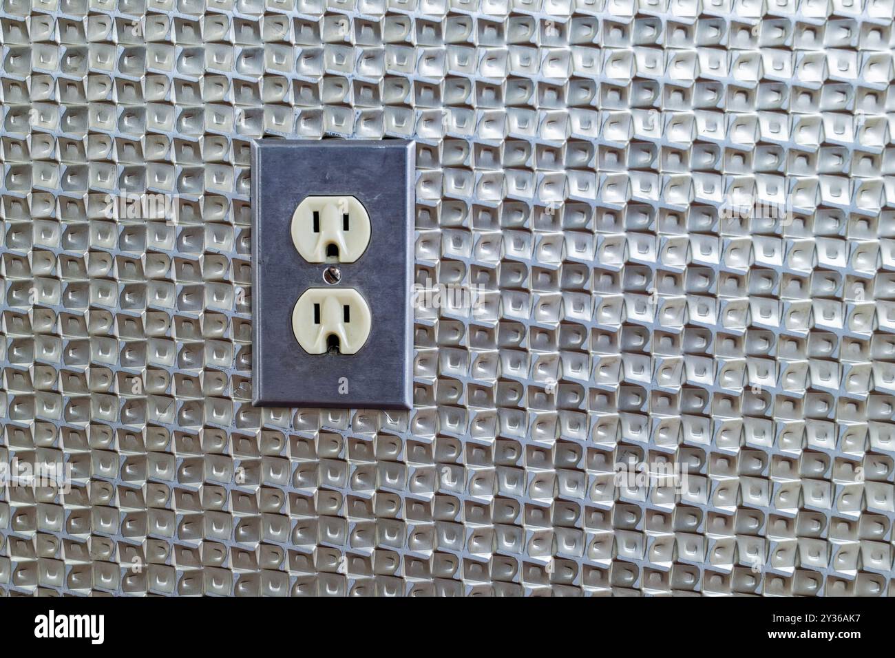120-volt duplex electrical outlet on a textured metal wall Stock Photo - Alamy
