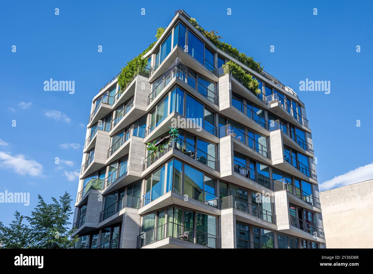 Modern apartment building with floor-to-ceiling windows seen in Berlin ...