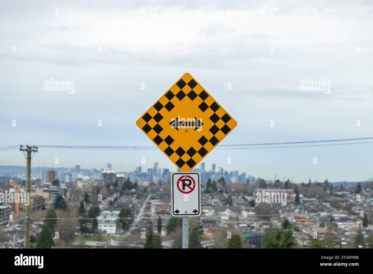 A road sign showing left and right directions with a "No Parking ...