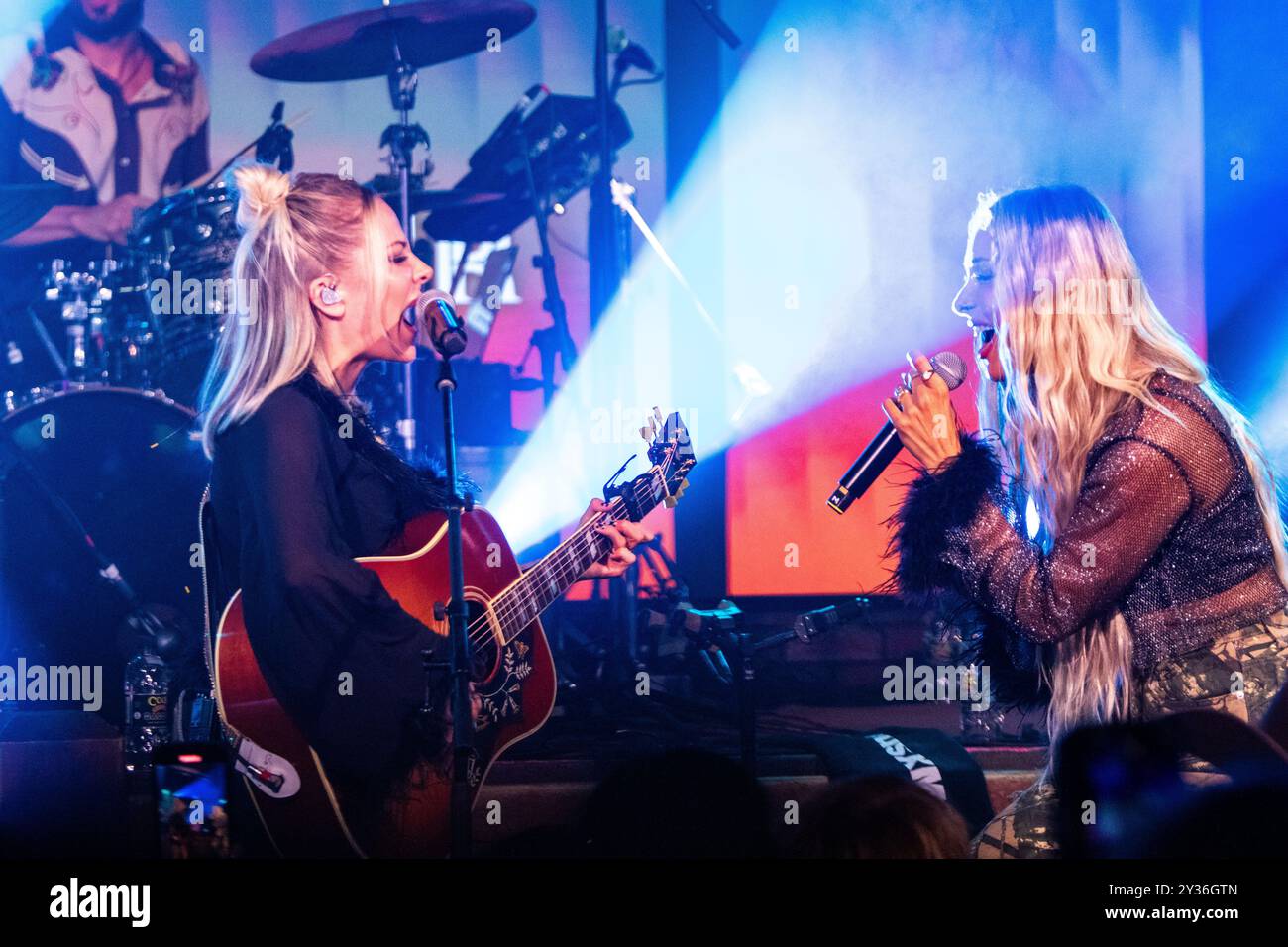 Madeline Merlo (R) joins MacKenzie Porter (L) on stage for the Finale ...