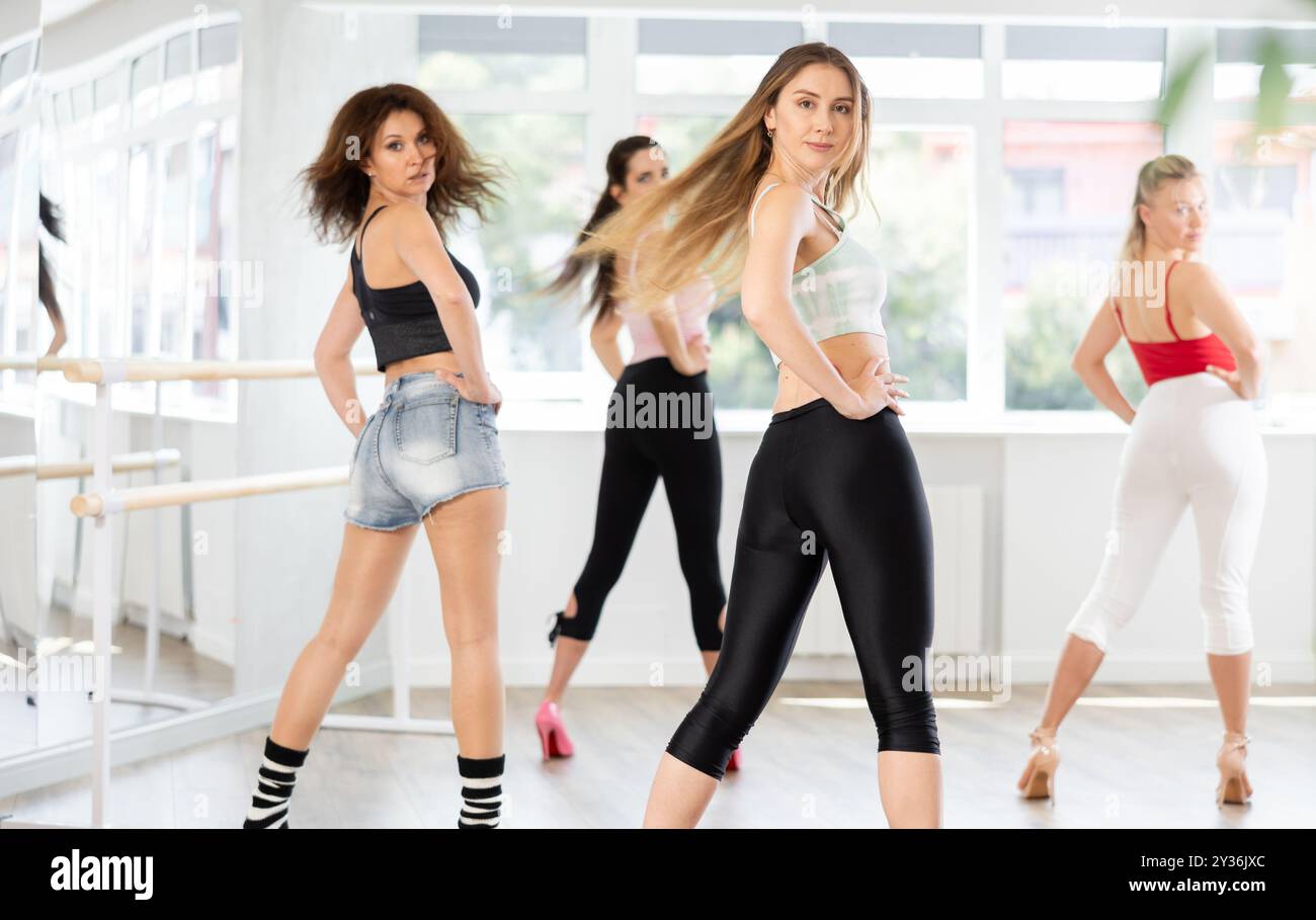 Group of women dancing high heels in studio Stock Photo - Alamy