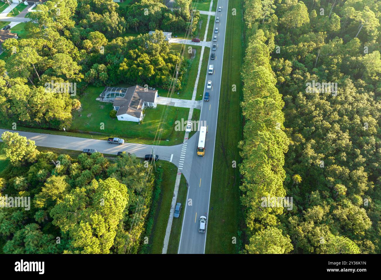 Line of kids getting into school bus hi-res stock photography and ...