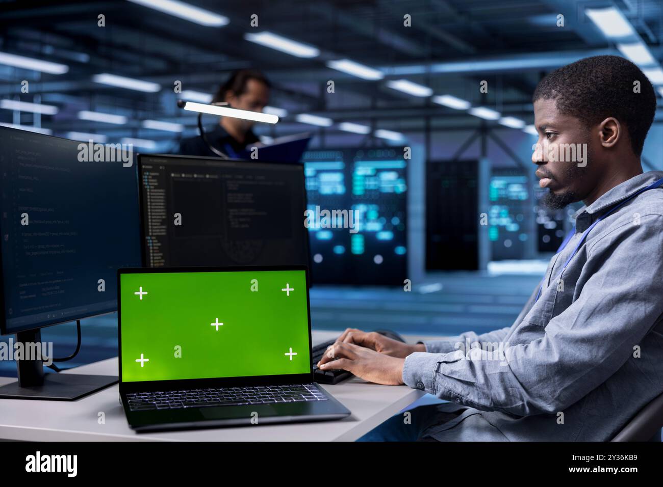 Engineer in data center running system diagnostic tests using isolated ... Engineer in data center running system diagnostic tests using isolated ...