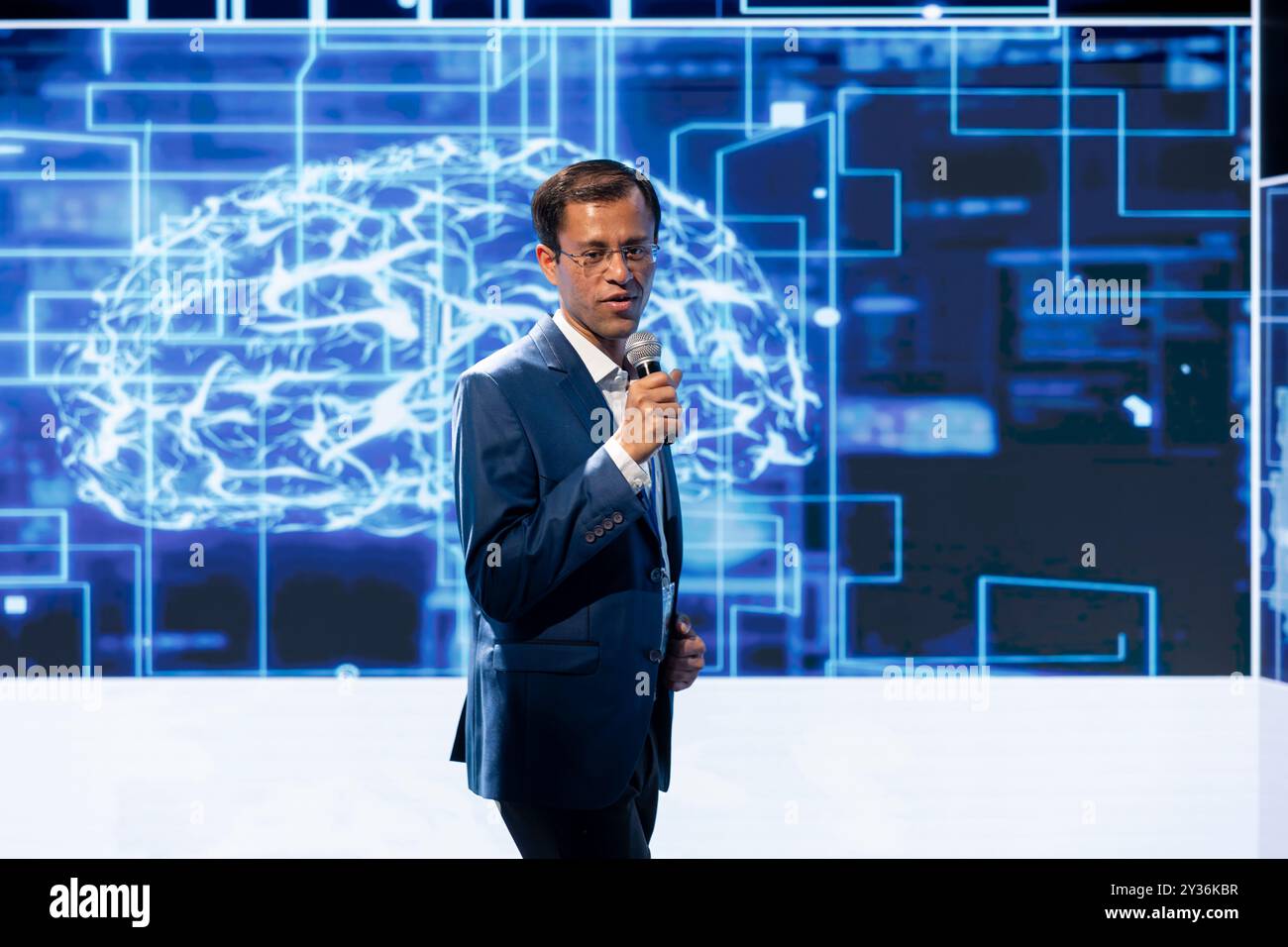 Engaging presenter talking at AI convention using microphone, sharing ...
