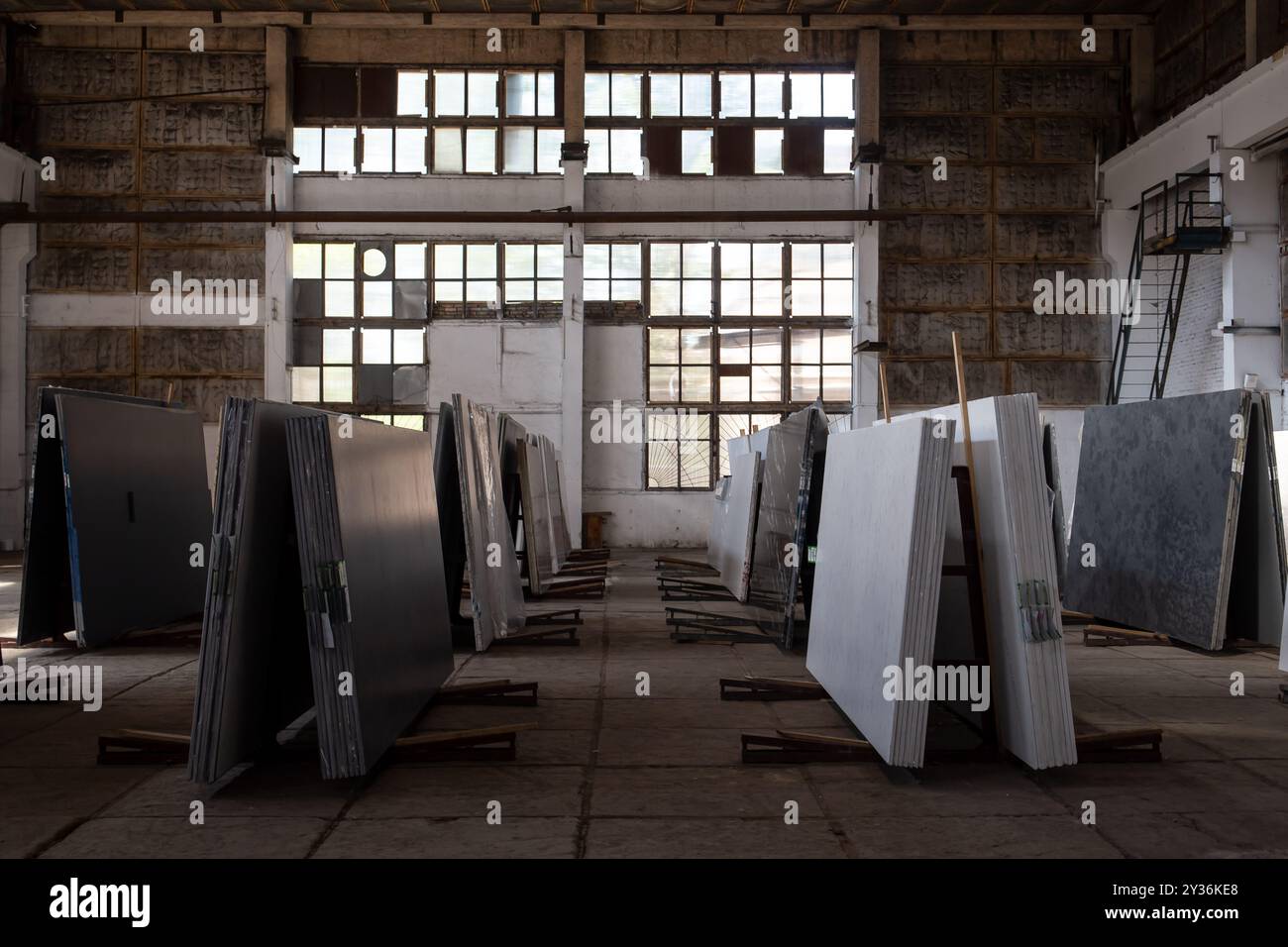 "Interior view of an industrial facility with large windows, featuring ...