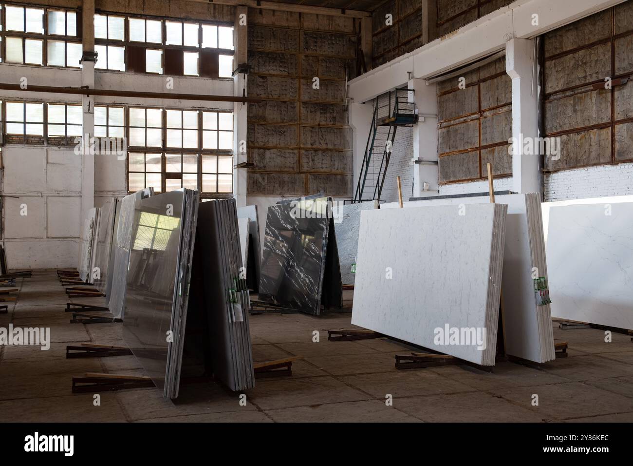"Interior view of an industrial facility with large windows, featuring ...
