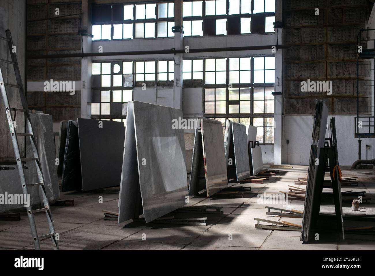 "Interior view of an industrial facility with large windows, featuring ...