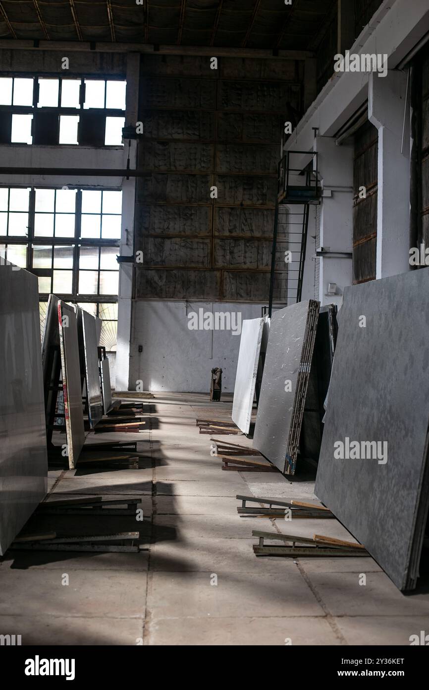 "Interior view of an industrial facility with large windows, featuring ...