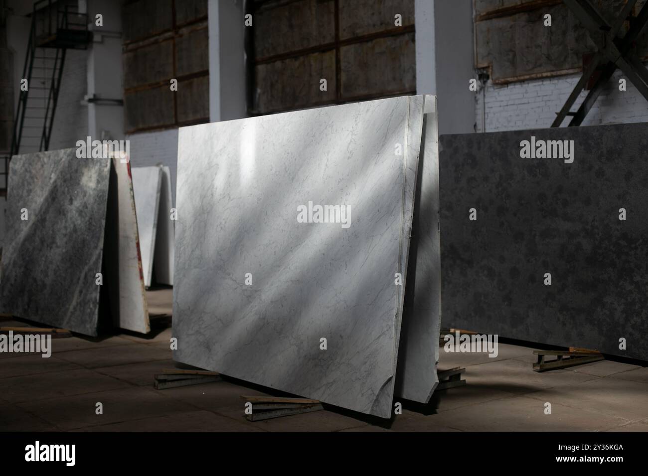 "Interior view of an industrial facility with large windows, featuring ...