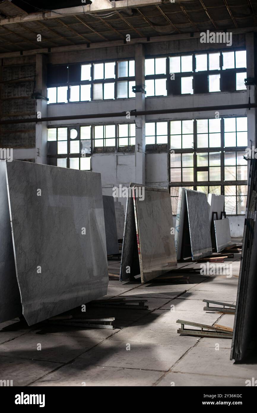 "Interior view of an industrial facility with large windows, featuring ...