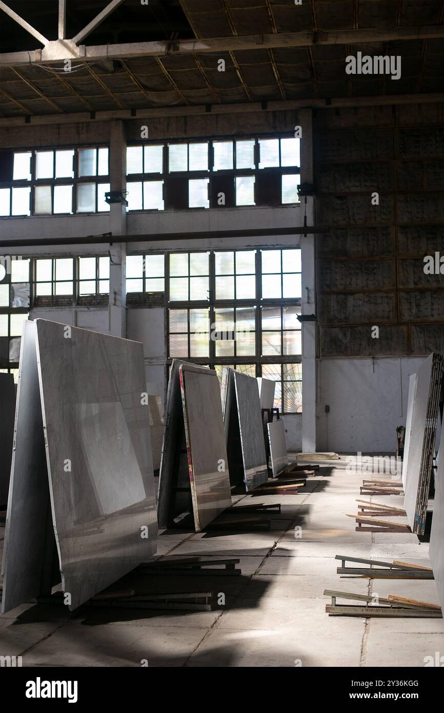 "Interior view of an industrial facility with large windows, featuring ...