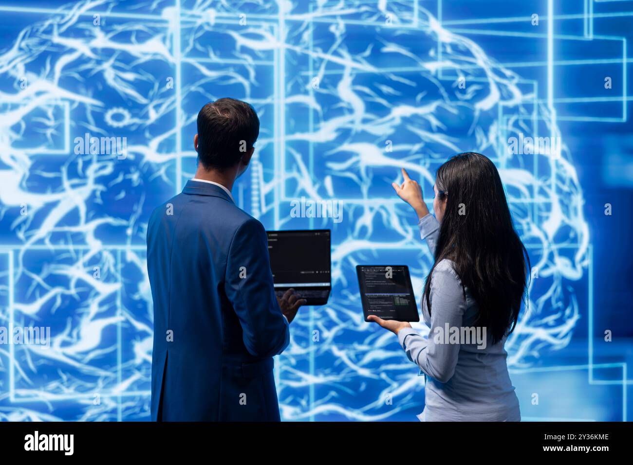 Team of admins using tablet and laptop to do maintenance on artificial ...