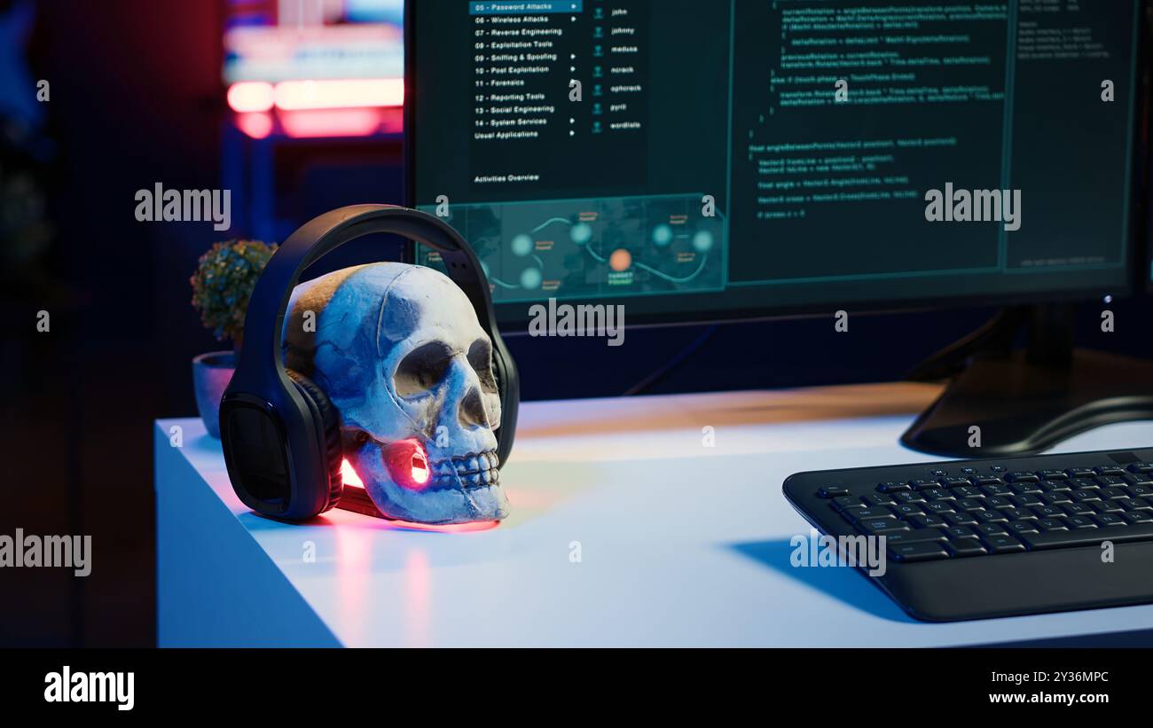 Desk with decorations in empty criminals den and hacking software interface on PC screens ...