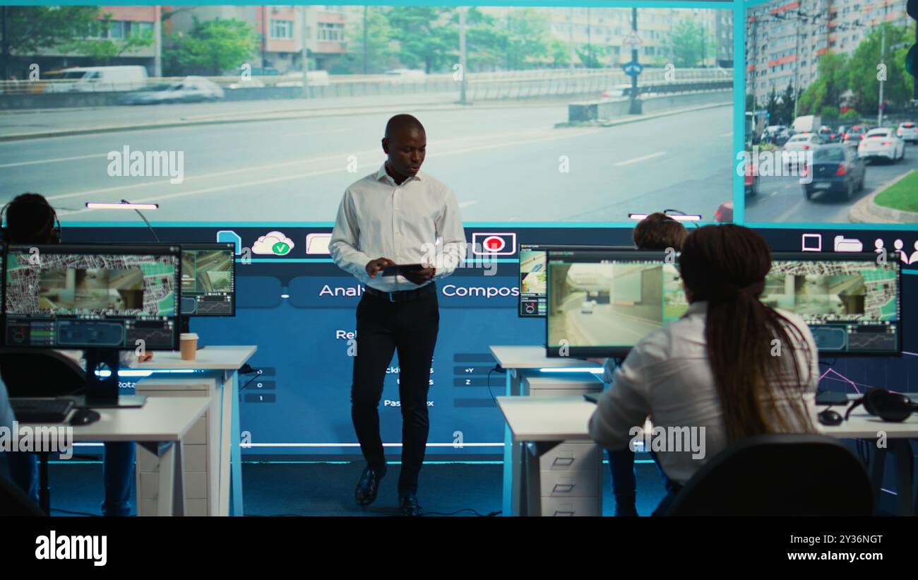 Diverse employees monitoring urban hi-res stock photography and images ...