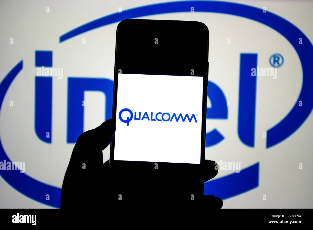 In this photo illustration, an Qualcomm logo seen displayed on a ...