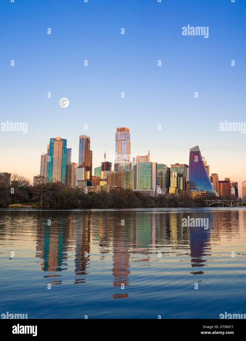 Austin Texas skyline buildings seen at sunset with full moon and Lady ...
